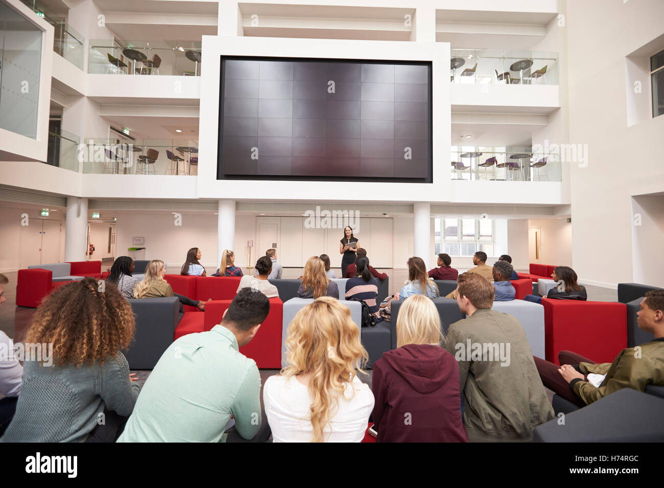 Back view of students at a lecture in a university atrium Stock Photo ...