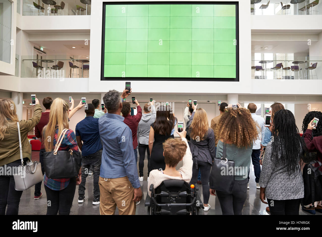 Three students looking at screen hi-res stock photography and images ...