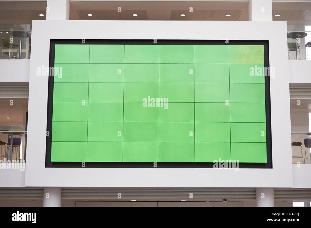 Big screen, AV monitor, in a university lobby atrium Stock Photo - Alamy