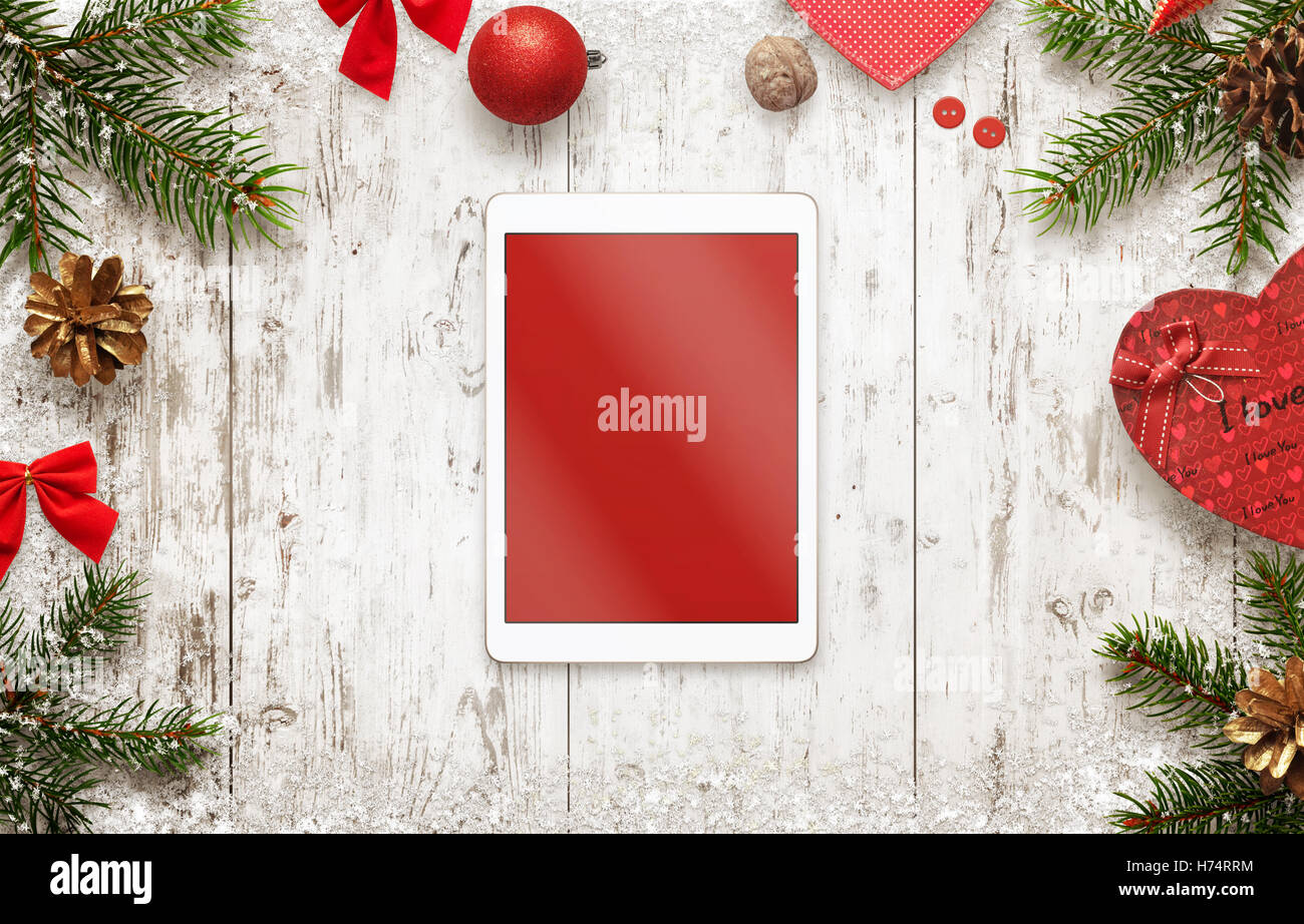 Tablet with isolated screen for mockup with christmas decorations on ...