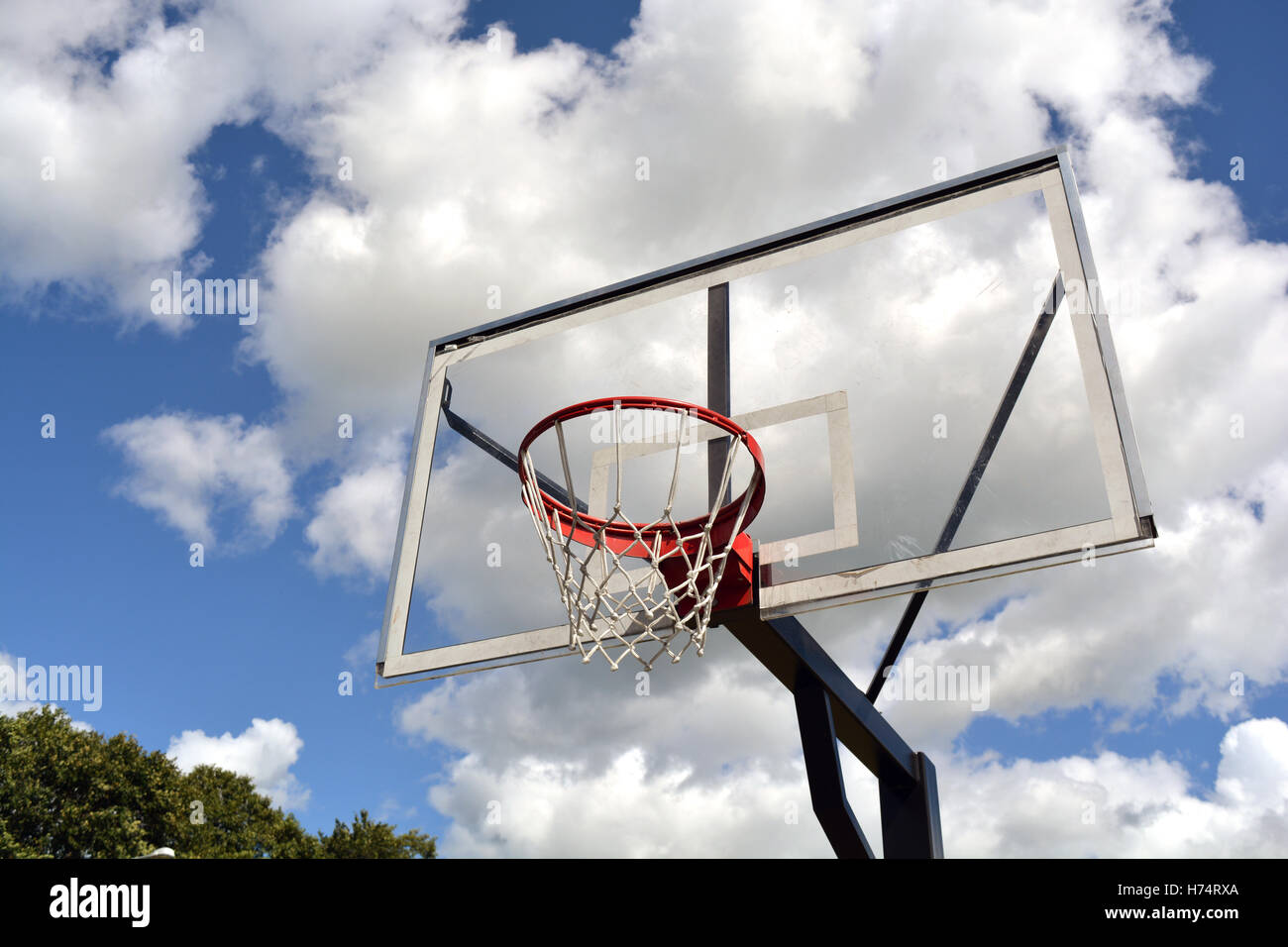 basketball backboard on blue cloudy sky background in park Stock Photo ...