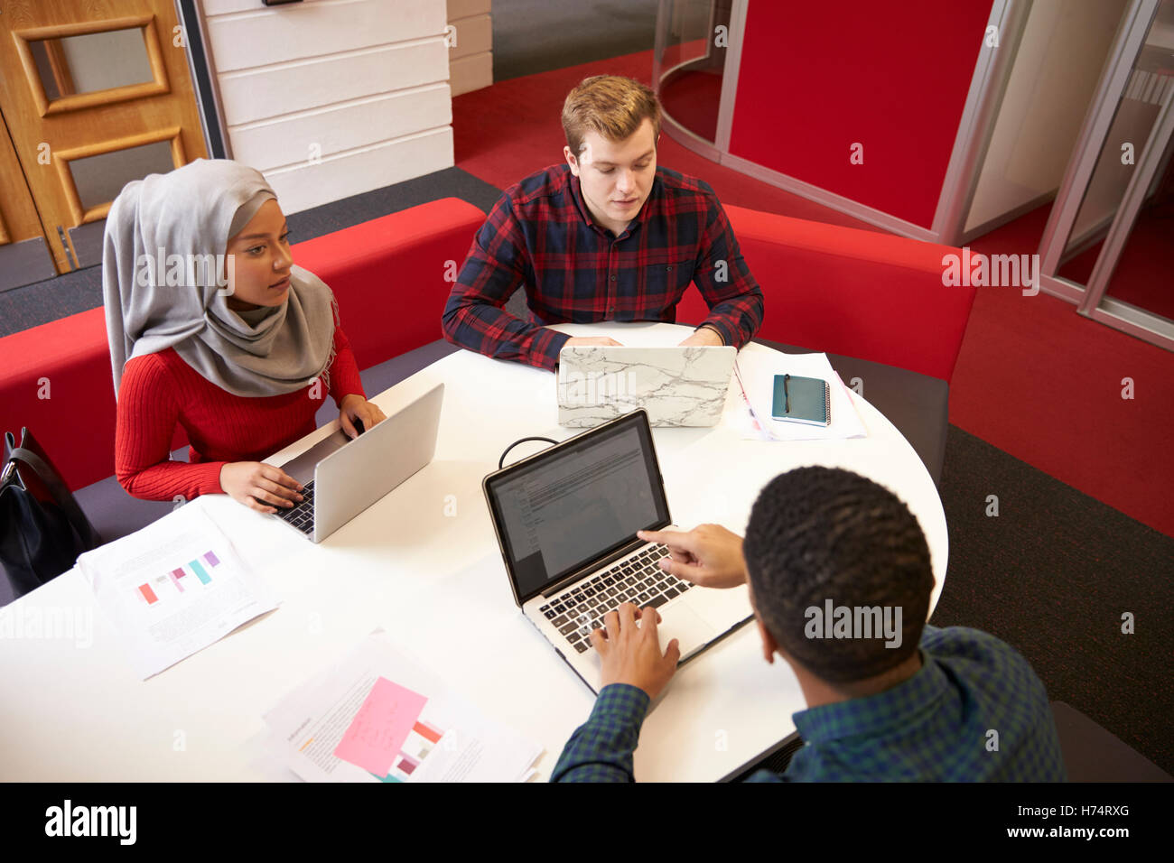 Group Of University Students Collaborating On Project Stock Photo - Alamy