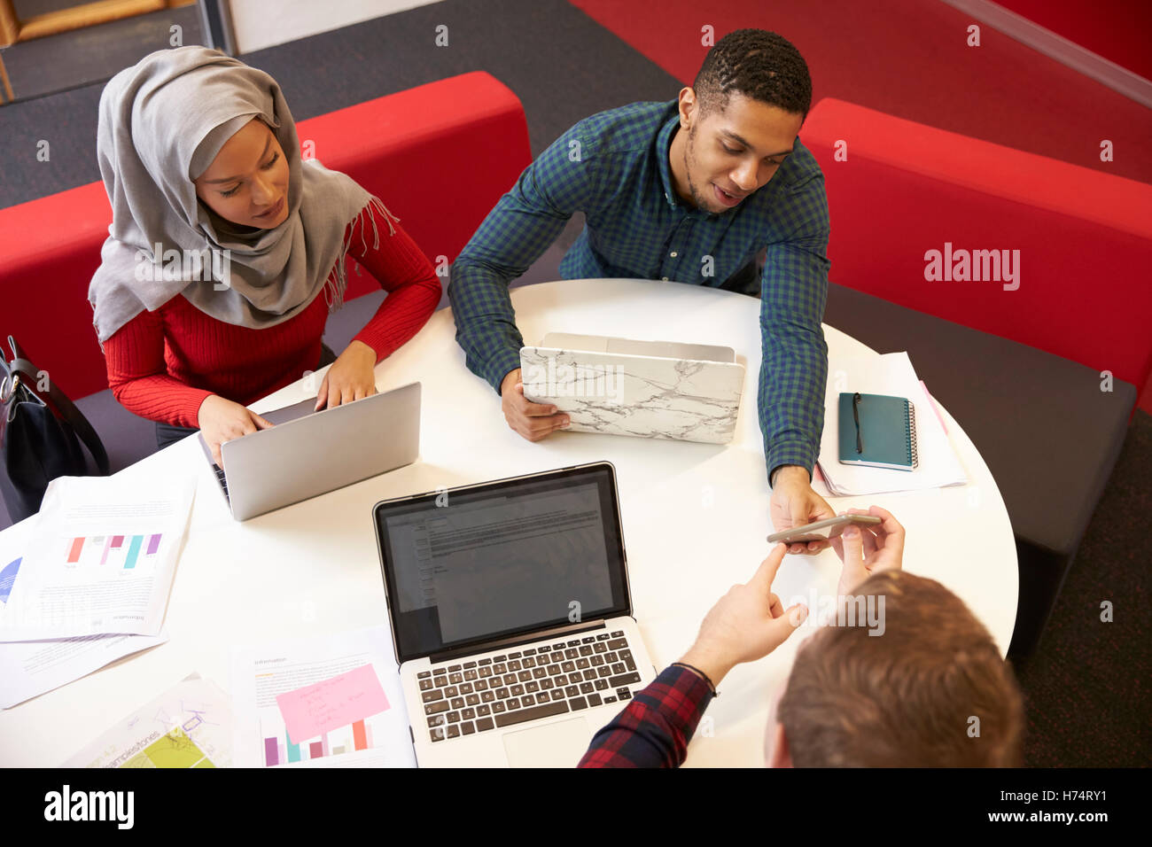 Group Of University Students Collaborating On Project Stock Photo - Alamy