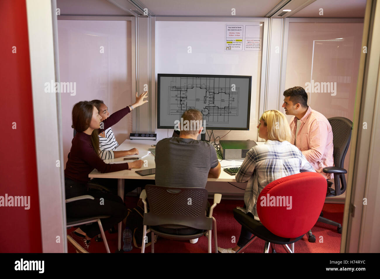 Group Of Students Around Screen Collaborating On Project Stock Photo ...