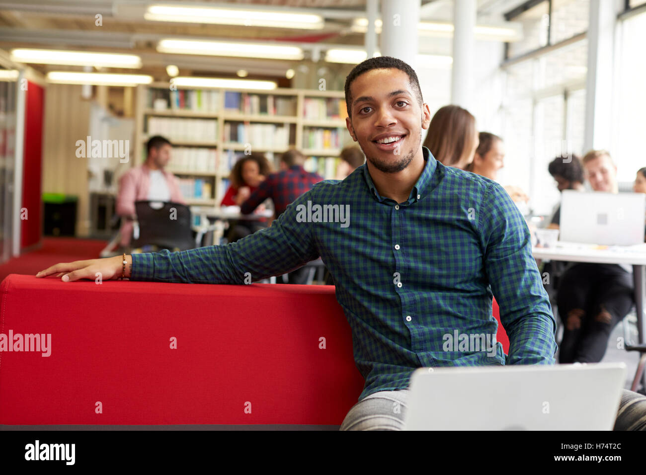 Male university student working in hi-res stock photography and images ...