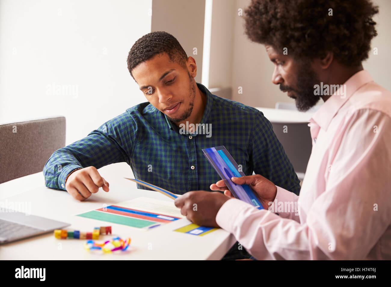 Tutor Using Learning Aids To Help Student With Dyslexia Stock Photo - Alamy