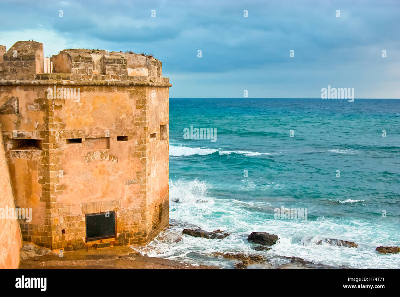 great medieval fortress tower that stands on the sea, alghero, sardinia ...