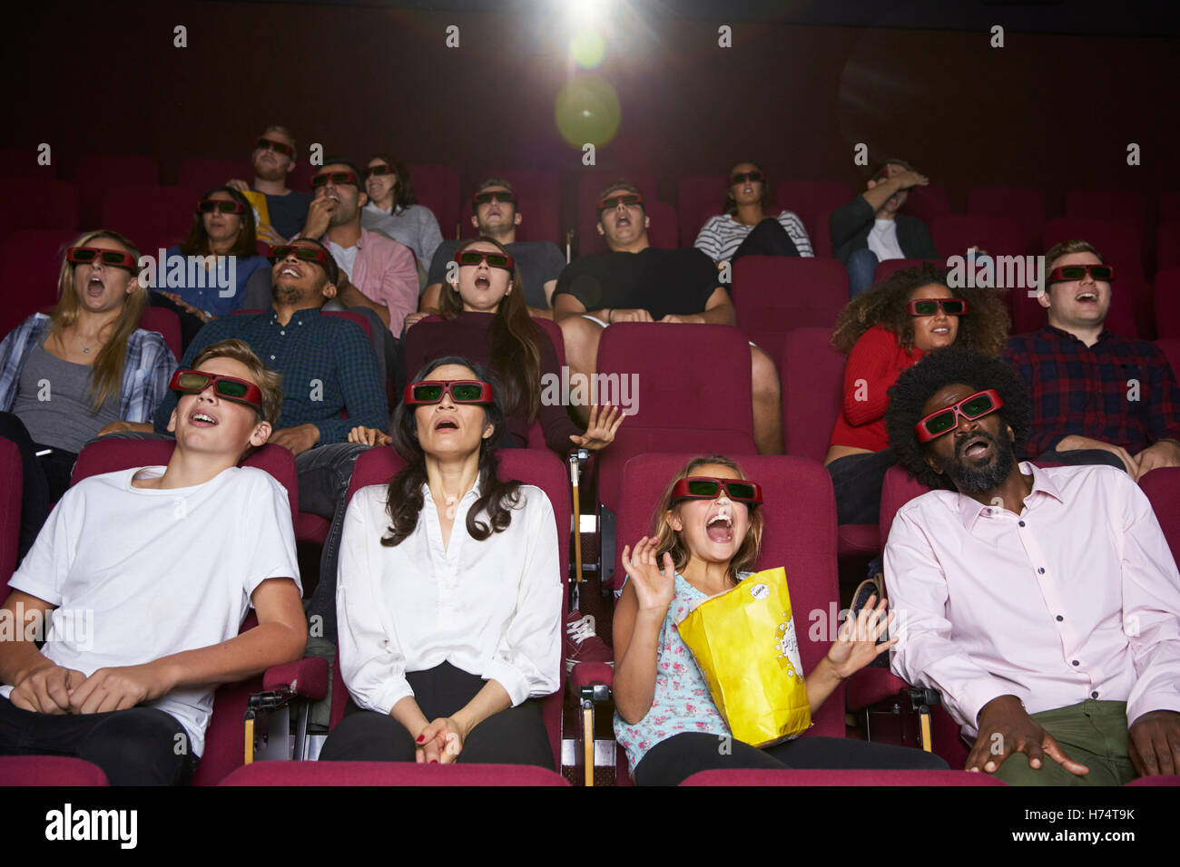 Audience In Cinema Wearing 3D Glasses Watching Horror Film Stock Photo ...