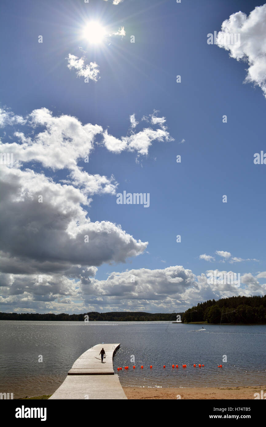 summer resort lake landscape with wooden bridge and sun Stock Photo - Alamy