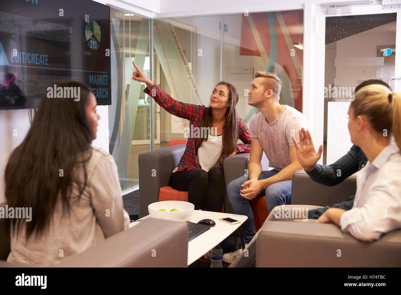 Group Of University Students Discussing Project Together Stock Photo ...