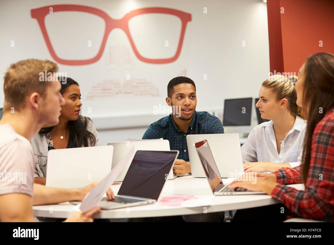 Group Of University Students Collaborating On Project Stock Photo - Alamy