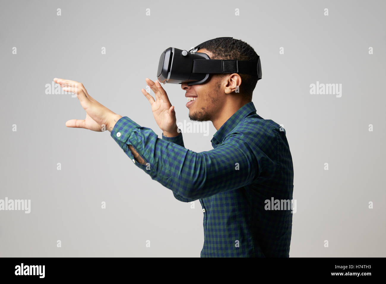 Studio Portrait Of Video Game Designer Wearing VR Headset Stock Photo ...