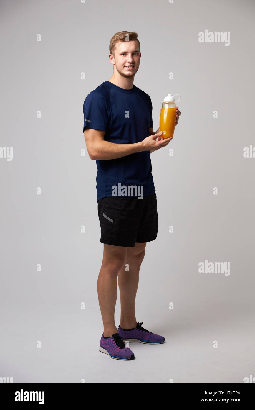 Studio Portrait Of Male Nutritionist With Drinks Bottle Stock Photo - Alamy