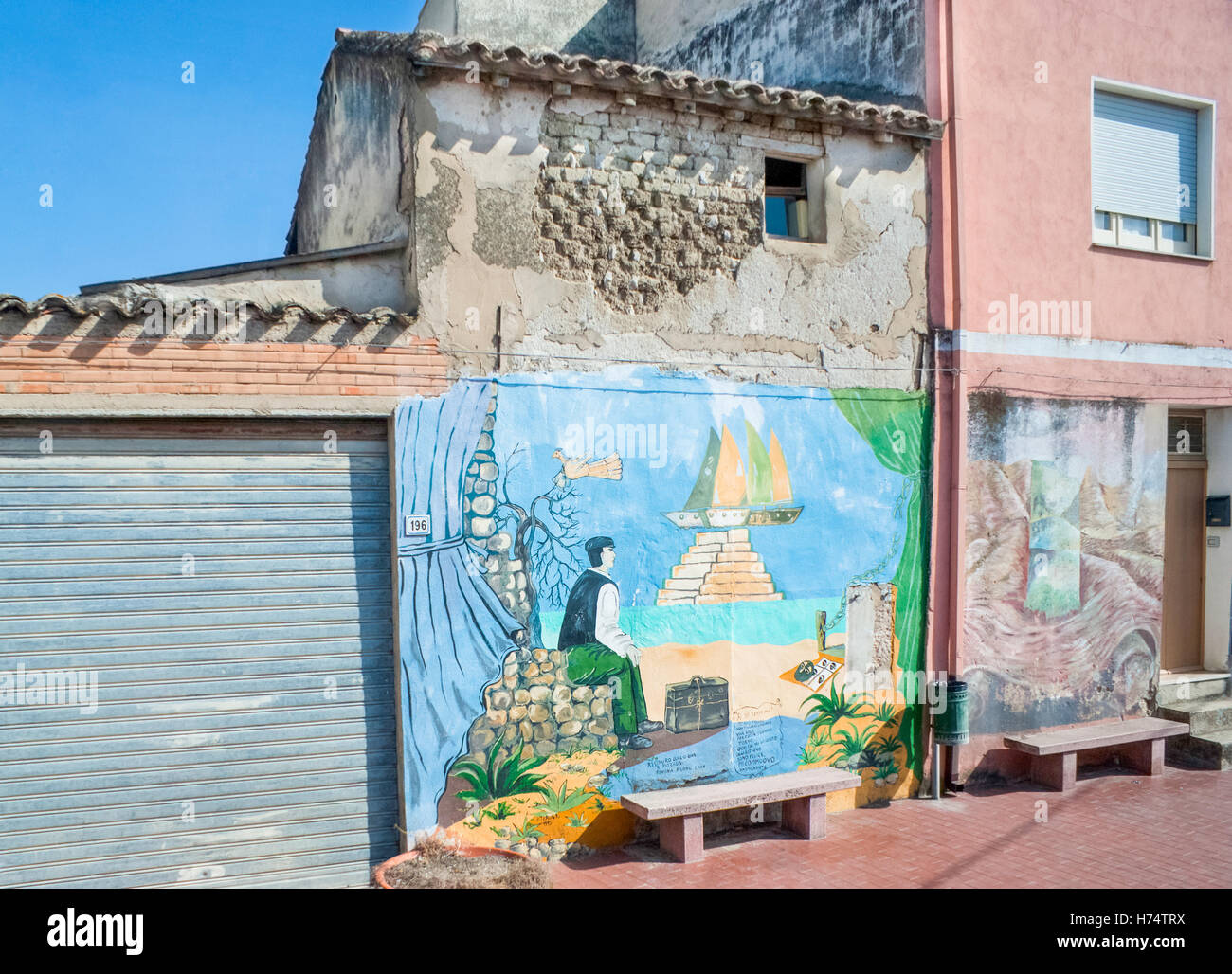 The painting on the wall is the traditional sardinian home decoration ...