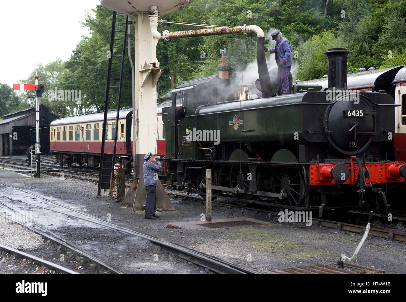 Steam train filling water hi-res stock photography and images - Alamy