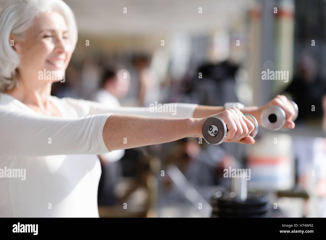 Delighted woman keeping fit Stock Photo - Alamy