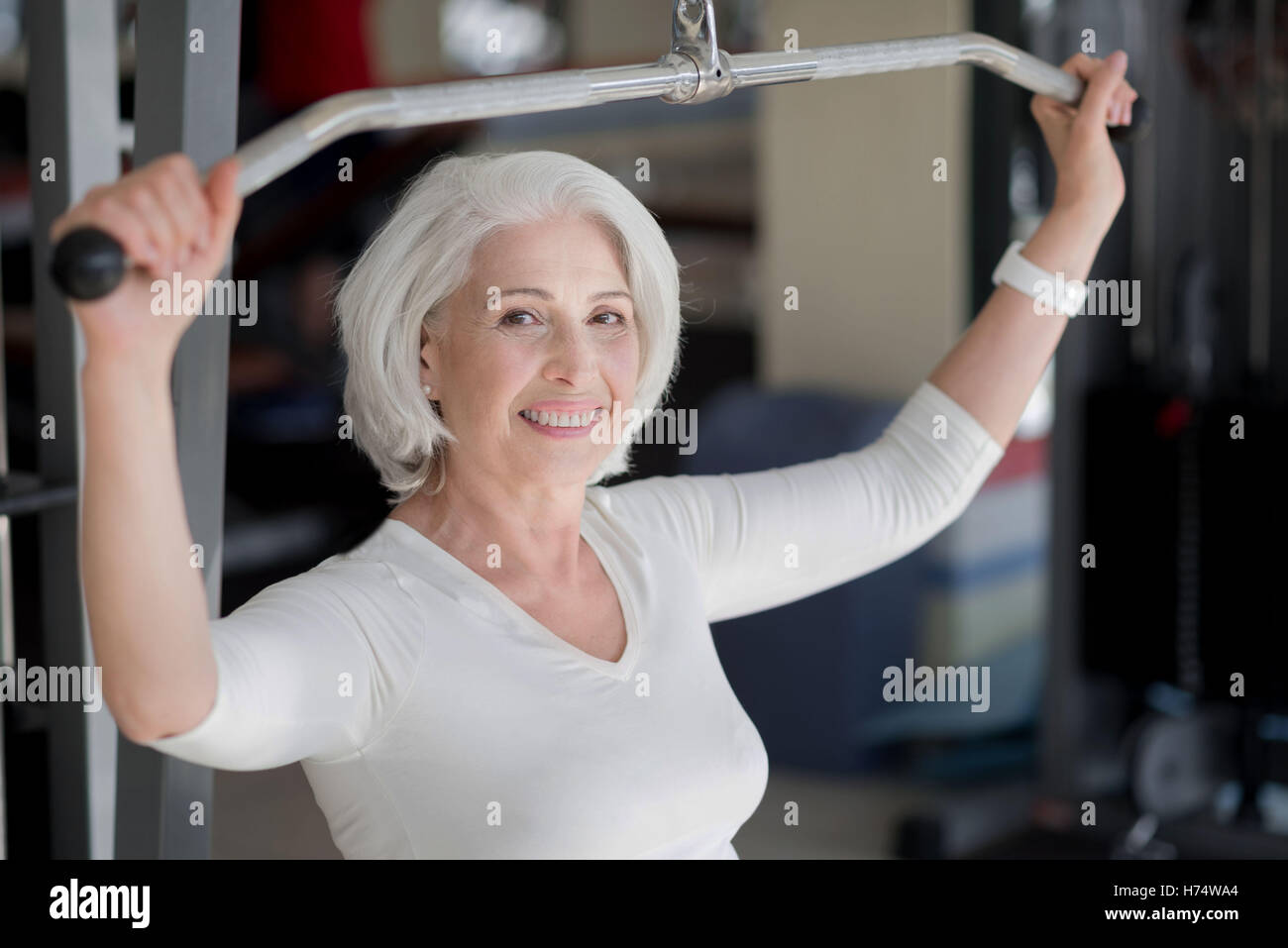 Cheerful fit senior woman keeping Stock Photo - Alamy