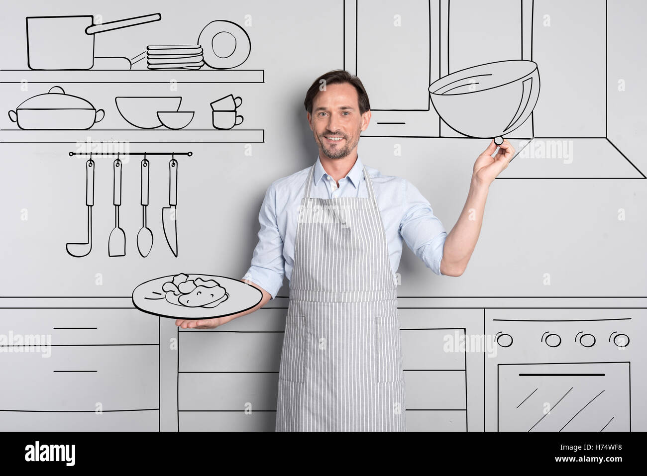 Professional delighted cook presenting his dish Stock Photo - Alamy