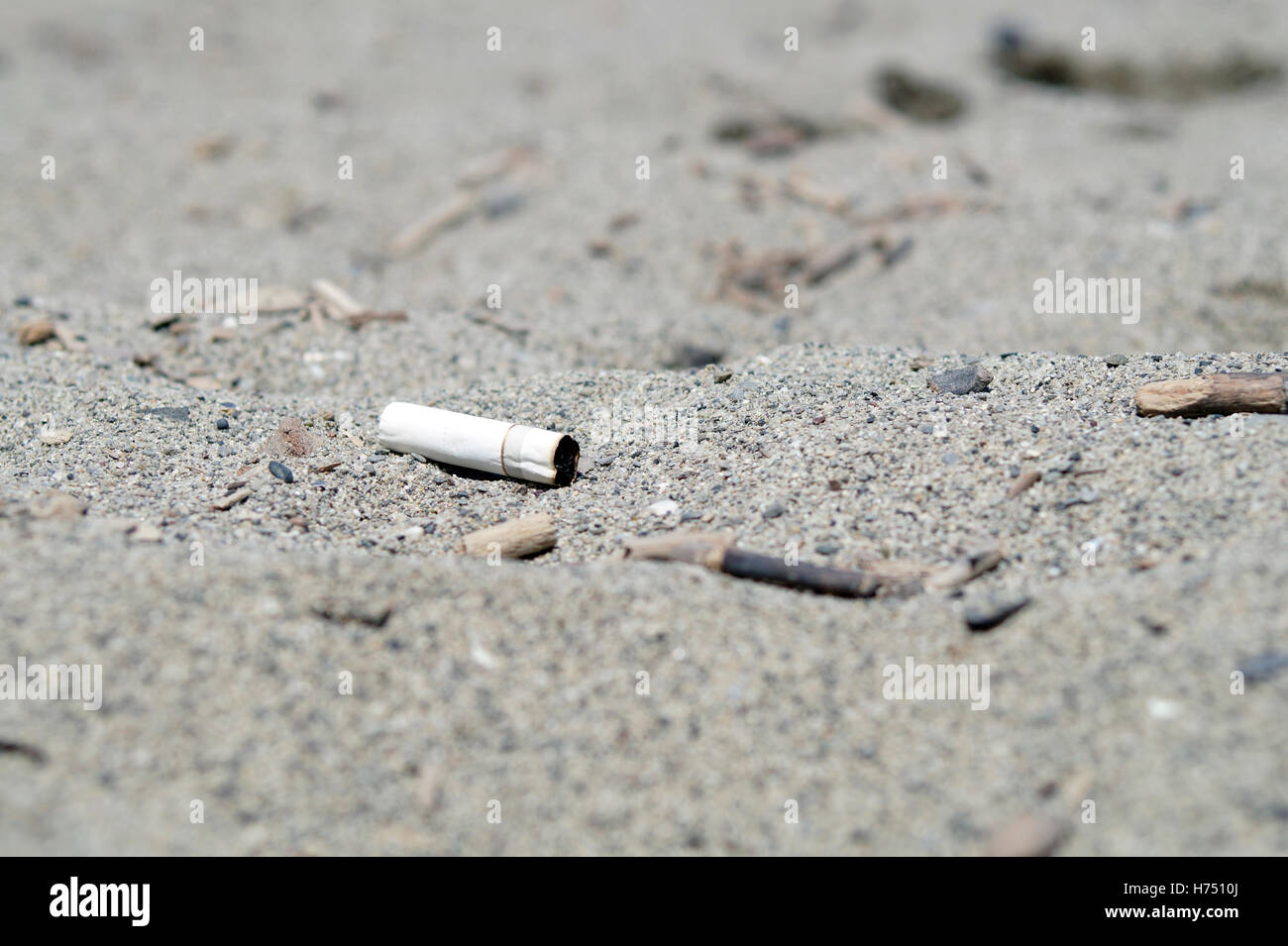 cigarette end on the beach Stock Photo - Alamy