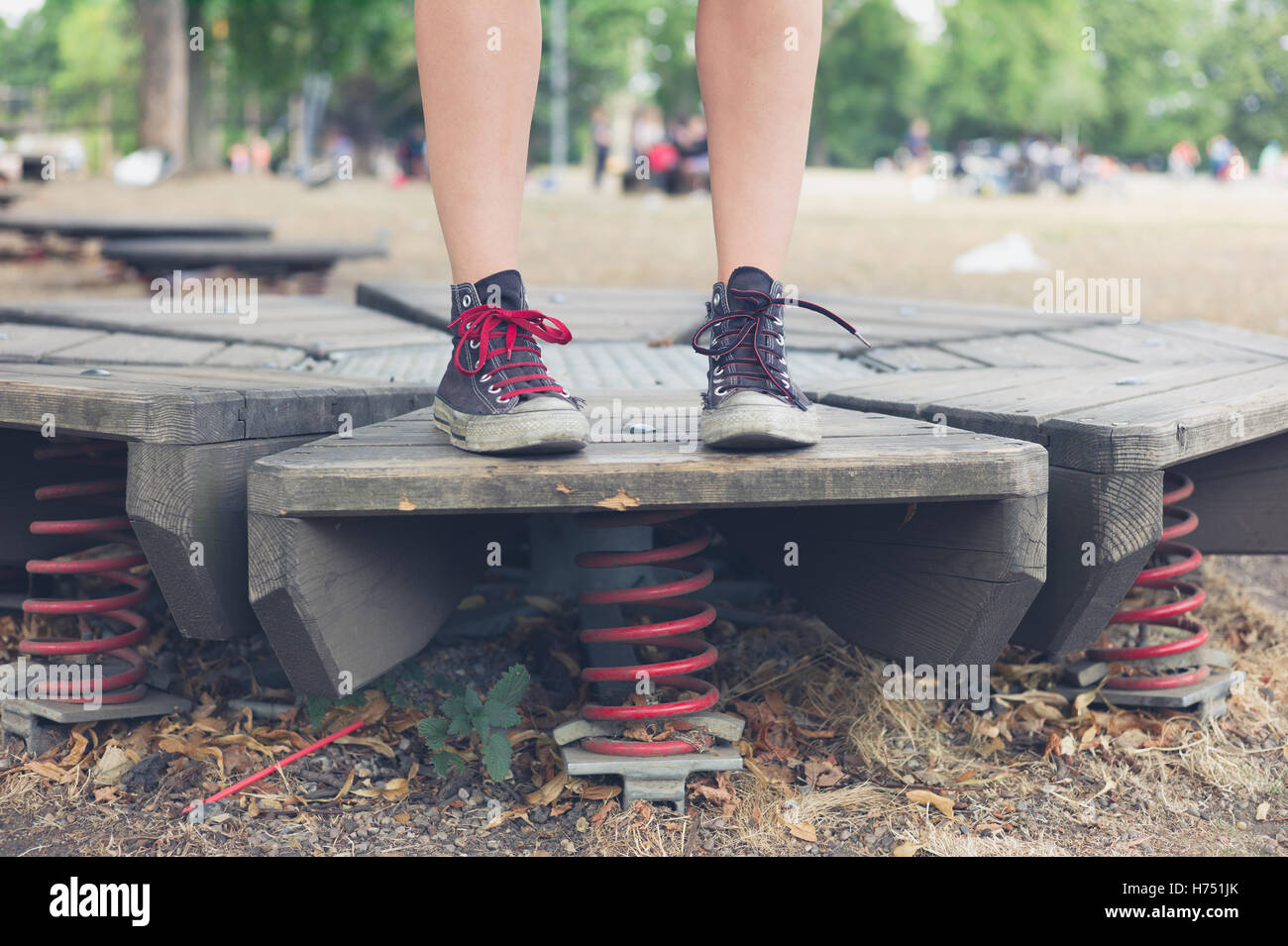 The feet of a young woman as she is standing on some equipment with ...