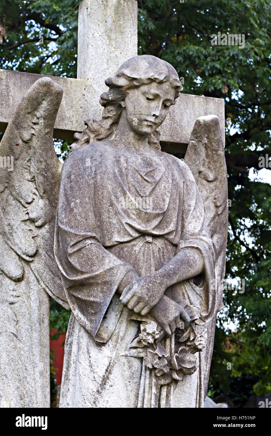 An old graveyard statue of an angel Stock Photo - Alamy