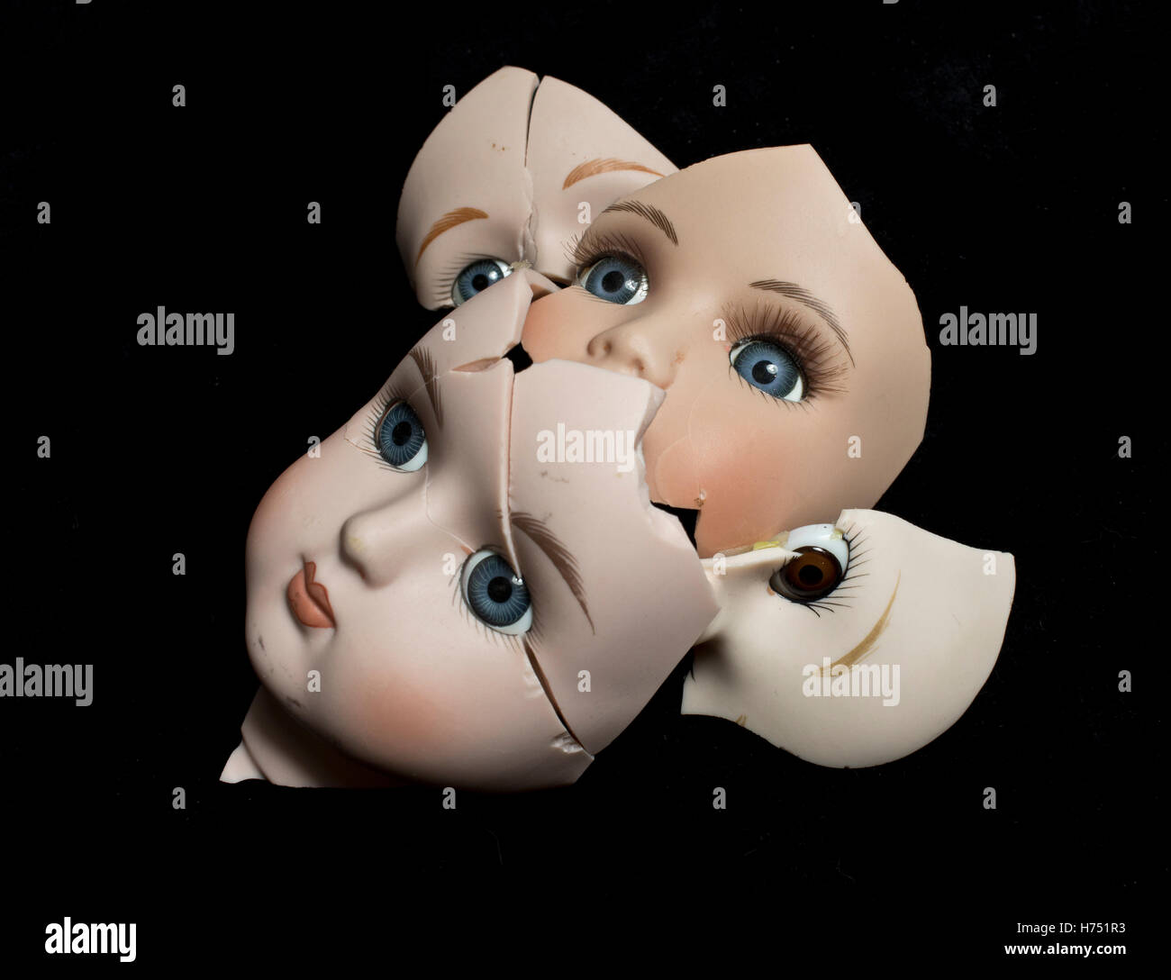 Broken Doll Face and Head on Black Background Stock Photo - Alamy