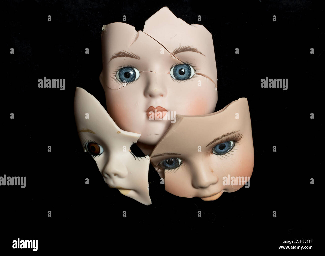 Broken Doll Face and Head on Black Background Stock Photo - Alamy