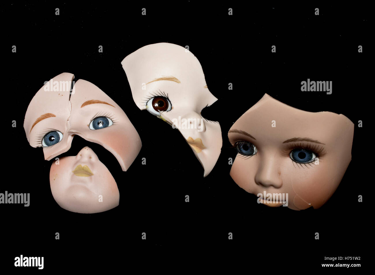 Broken Doll Face and Head on Black Background Stock Photo - Alamy