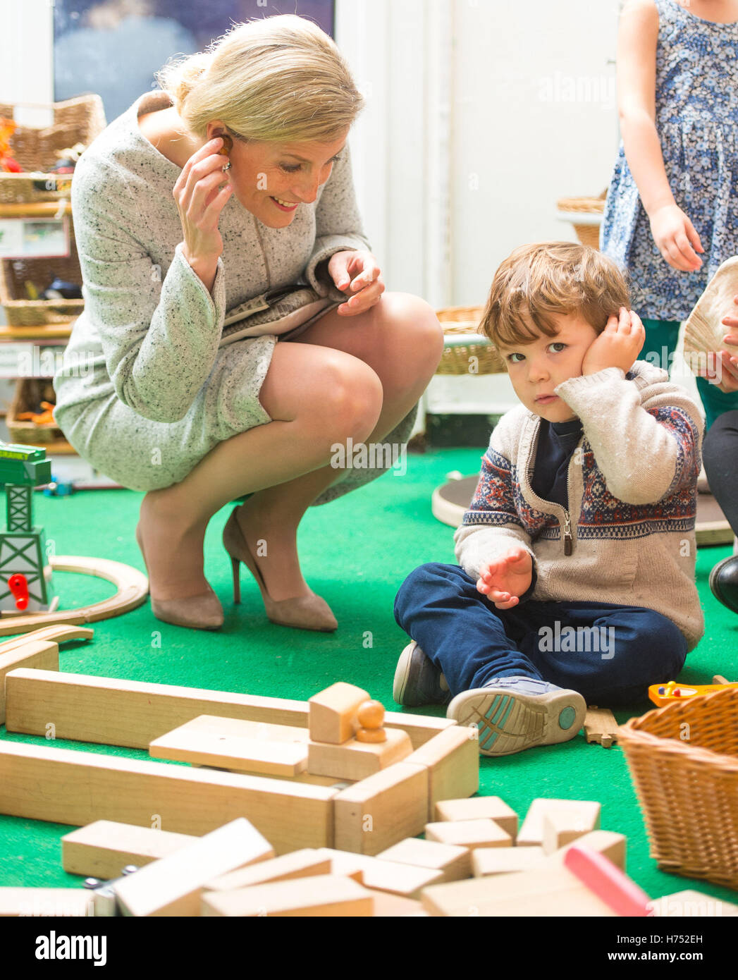 The Countess of Wessex holds a sea shell to her ear as she plays with ...