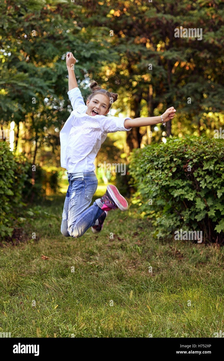 Little girl jumps Stock Photo - Alamy