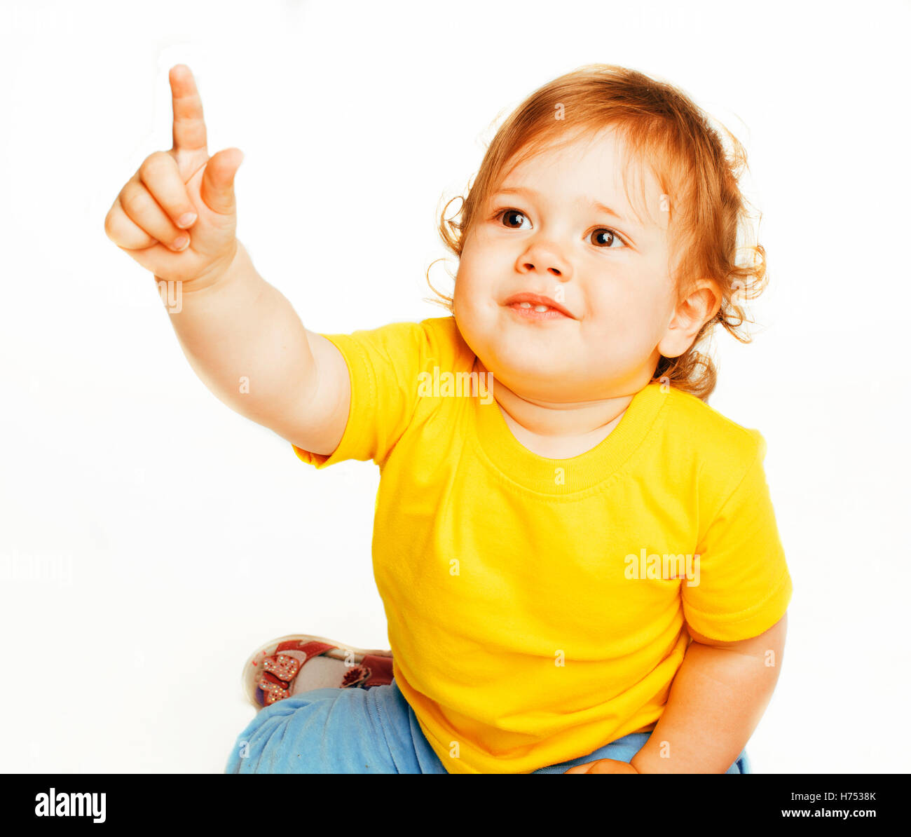 little cute baby girl pointing isolated on white close up Stock Photo ...