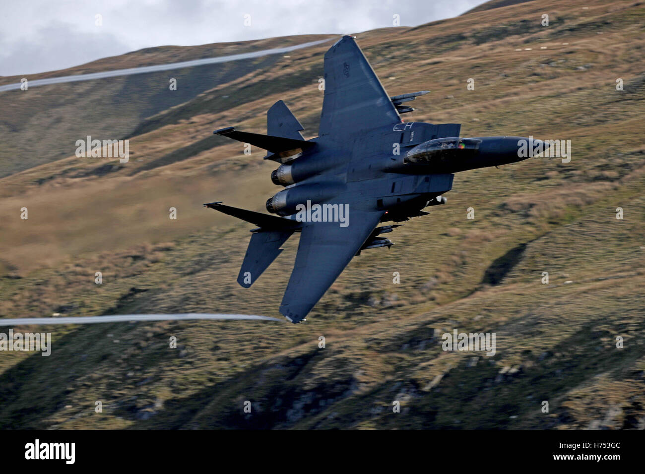 An F-15 jet is seen from Cad West, as it flies low level through the ...