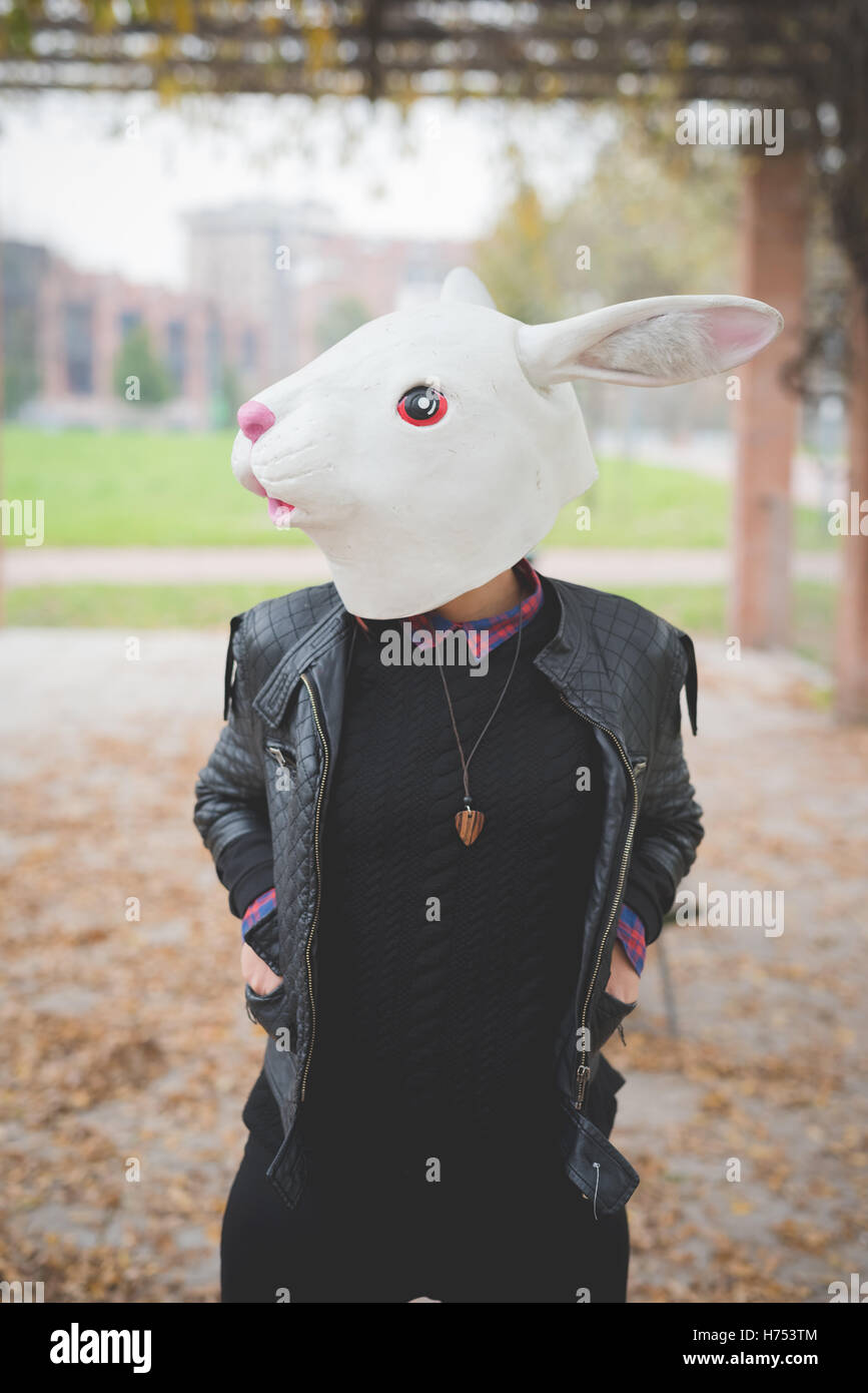 Woman wearing rabbit mask outdoor in autumn park - carnival, halloween ...