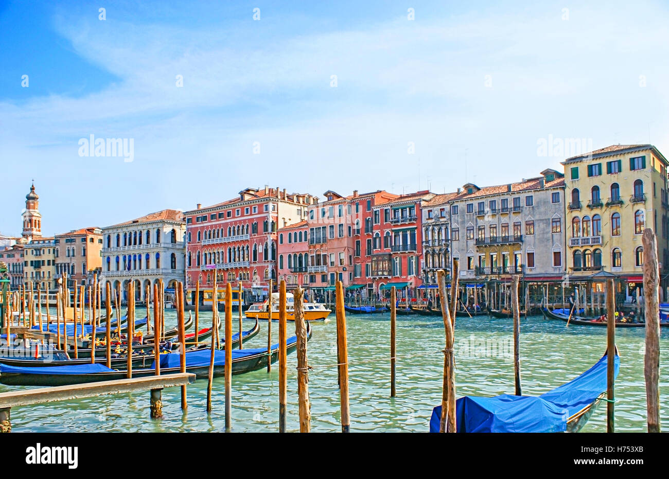 The Grand Canal with the numerous wooden poles for mooring gondolas and ...