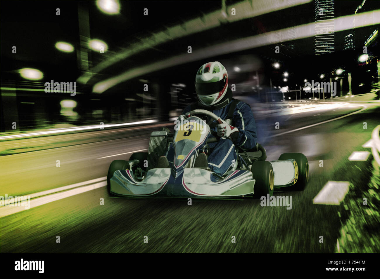 Karting - driver in helmet on kart circuit Stock Photo - Alamy