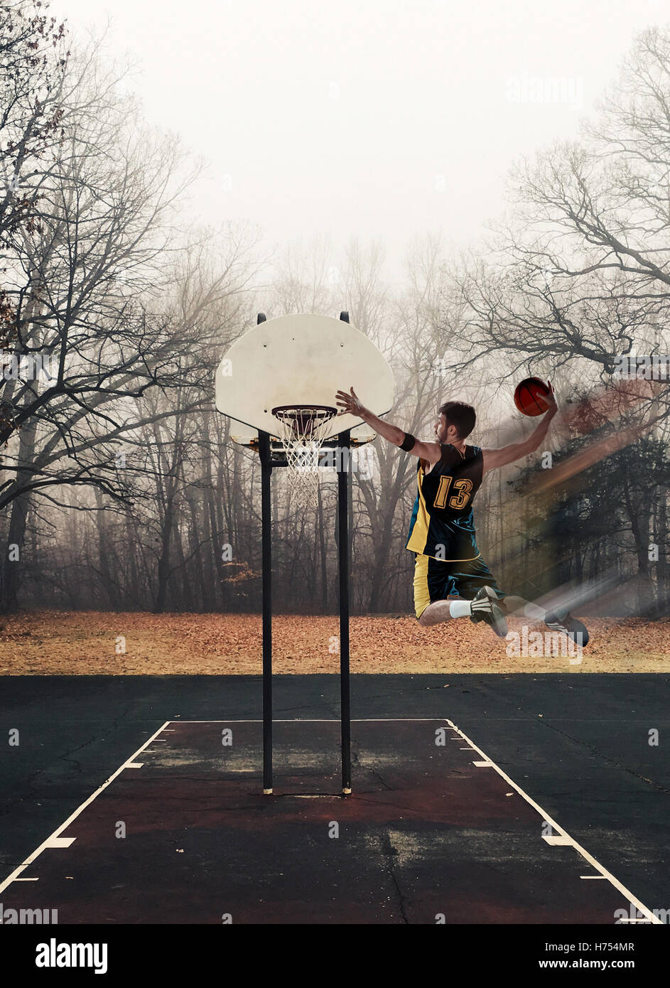 Full length portrait of a basketball player with ball Stock Photo - Alamy