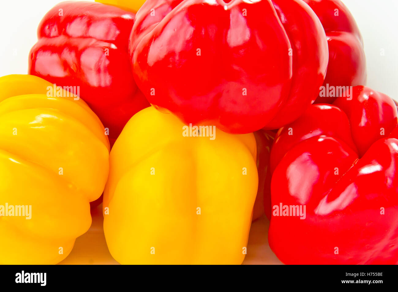 Photo of fresh red and yellow raw pepper on white background Stock ...