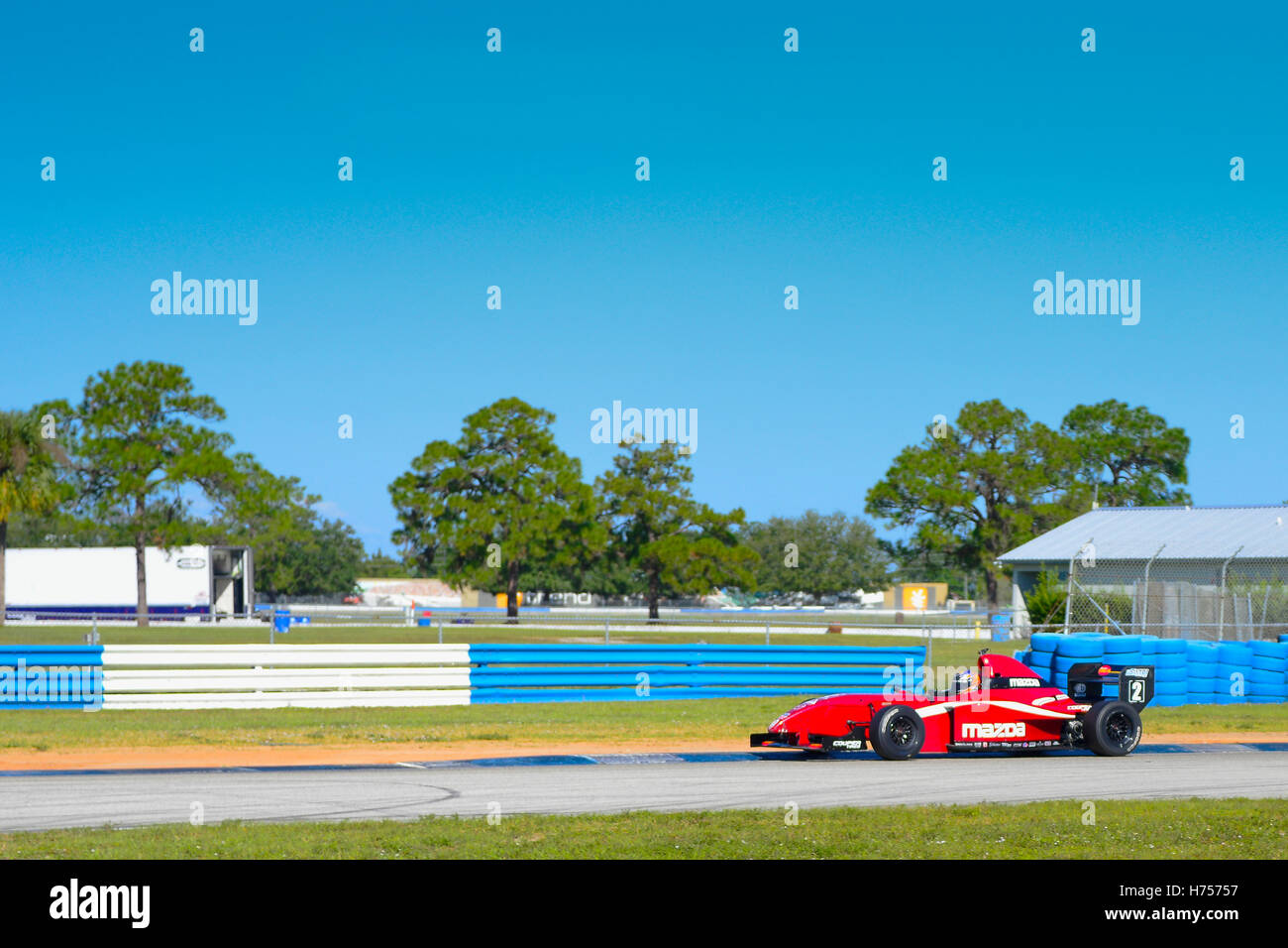 A Formula race car speeds down track at the Sebring International ...