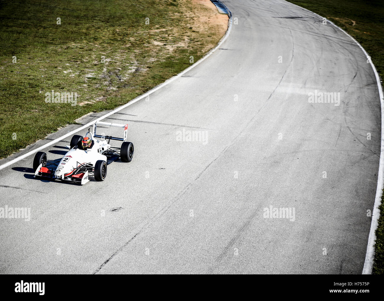 A Formula race car speeds down track at the Sebring International ...