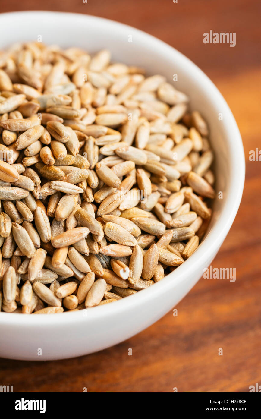Rye grains in a small bowl Stock Photo - Alamy