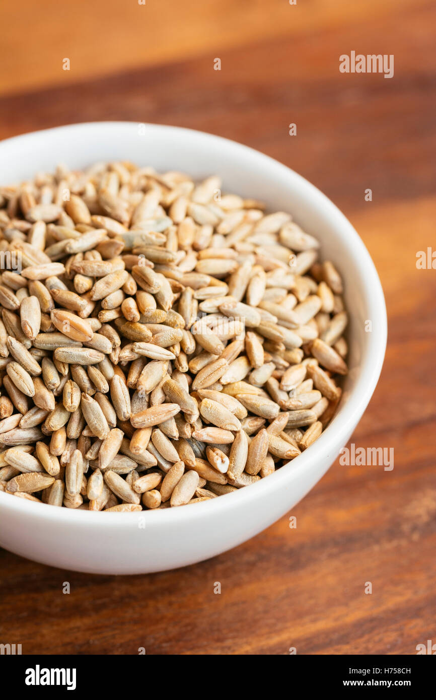 Rye grains in a small bowl Stock Photo - Alamy