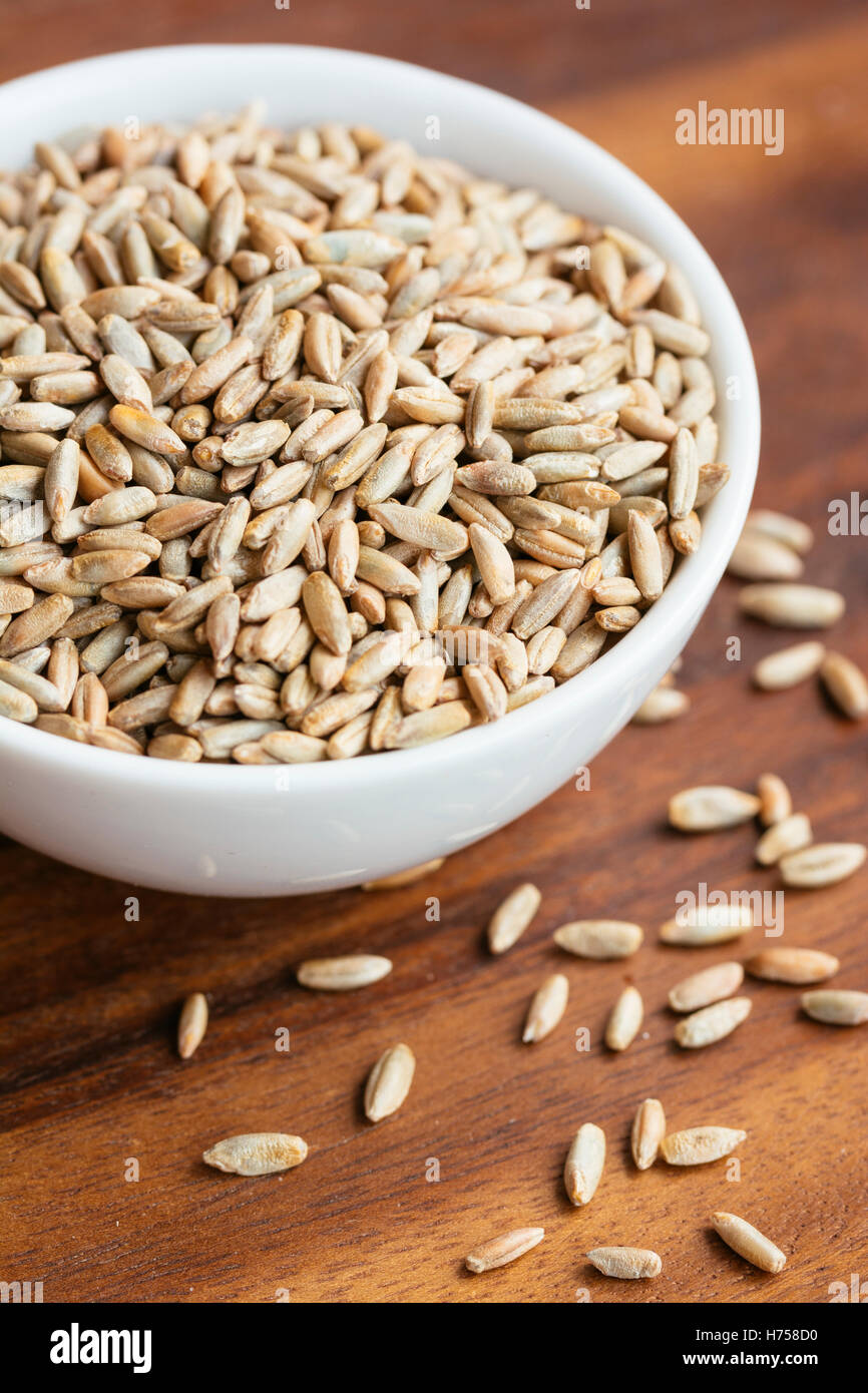 Rye grains in a small bowl Stock Photo - Alamy