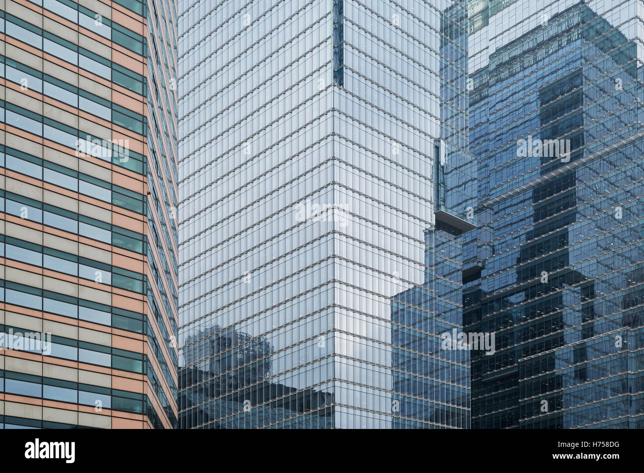 Skyscrapers reflective glassy walls and reflections of another ...
