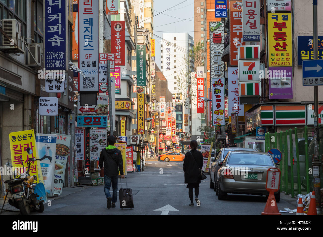 Two people walking at the Jongno 2(i)-ga street in Jongno District ...