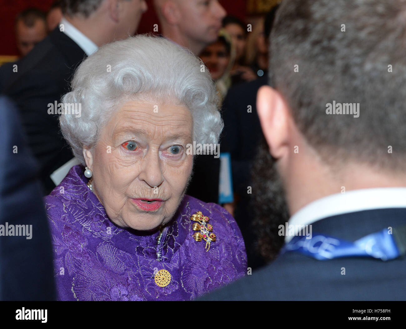 Queen Elizabeth II speaks to Ed Leon Klinger during the opening of ...