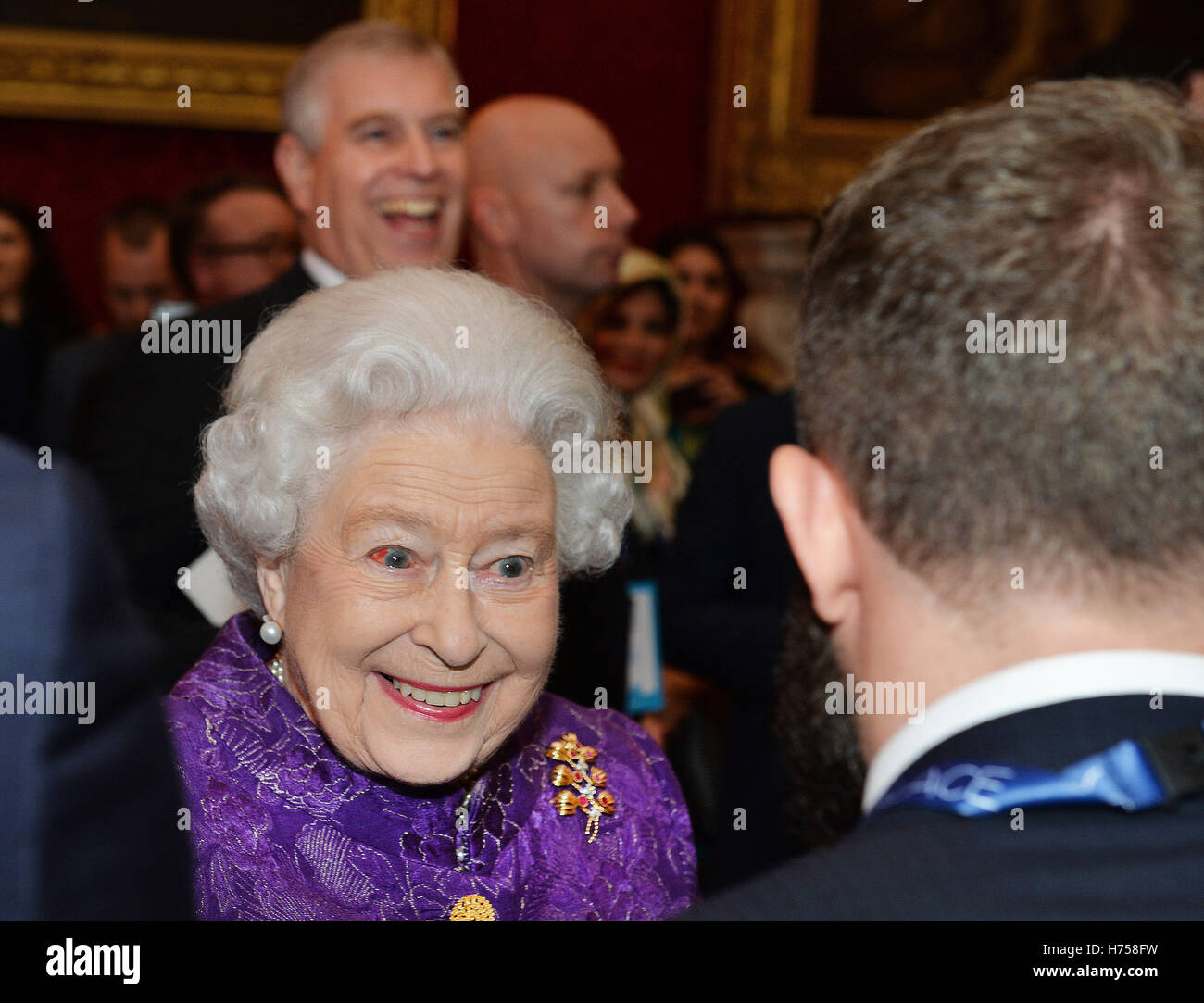 Queen Elizabeth II speaks to Ed Leon Klinger during the opening of ...