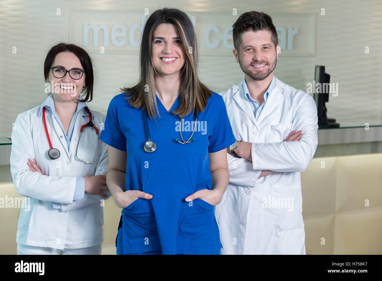 Three hospital workers smiling hi-res stock photography and images - Alamy