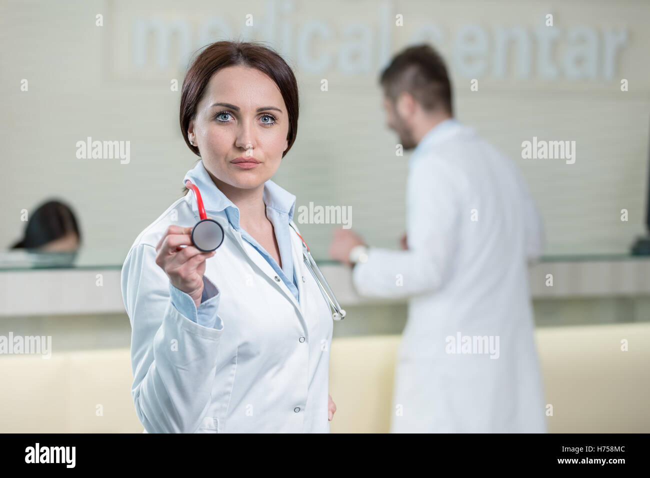 Portrait of woman doctor at hospital corridor Stock Photo - Alamy