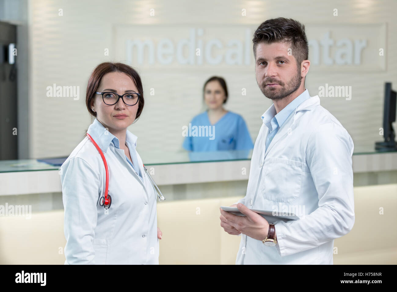 Medical Staff Having Discussion In Modern Hospital Corridor Stock Photo ...