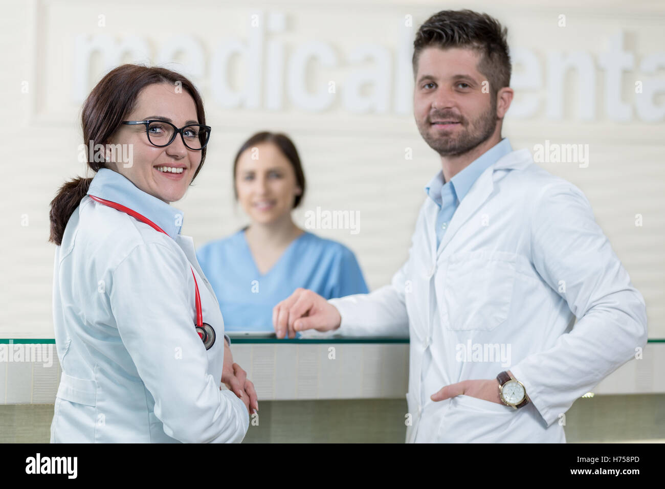 Medical Staff Having Discussion In Modern Hospital Corridor Stock Photo ...